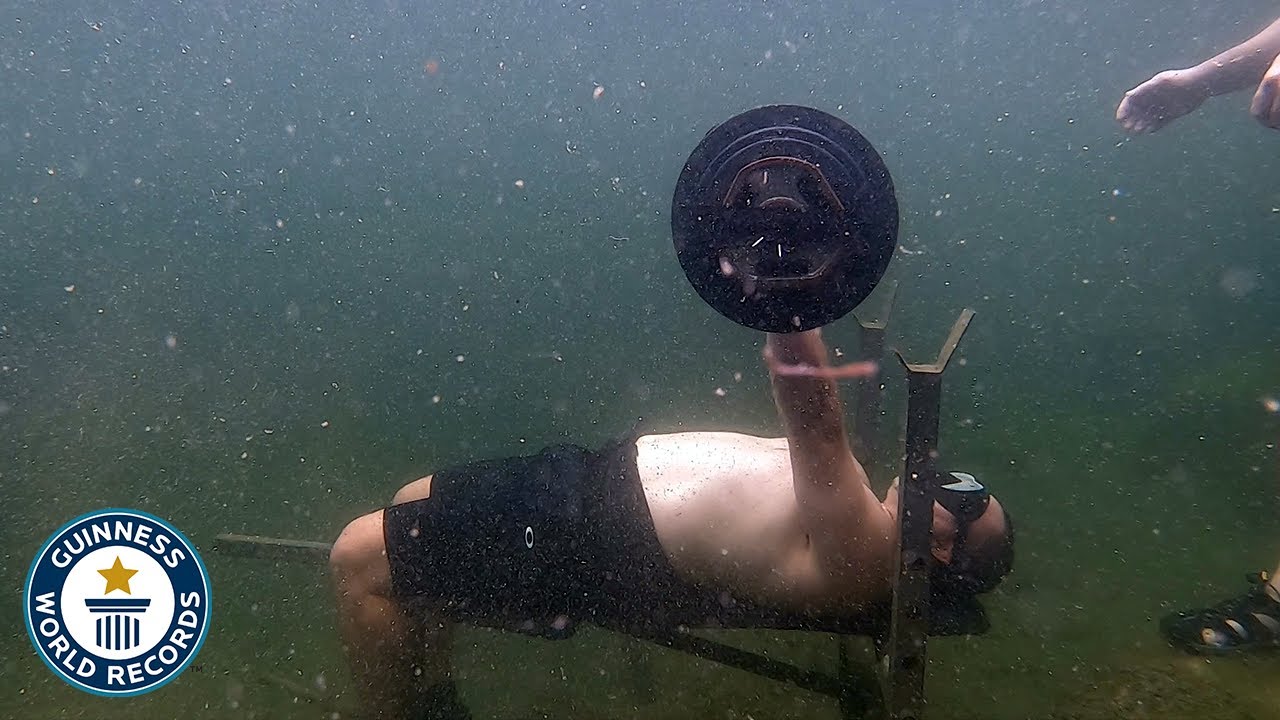 Most bench presses underwater – Guinness World Records | Swimmer's Daily